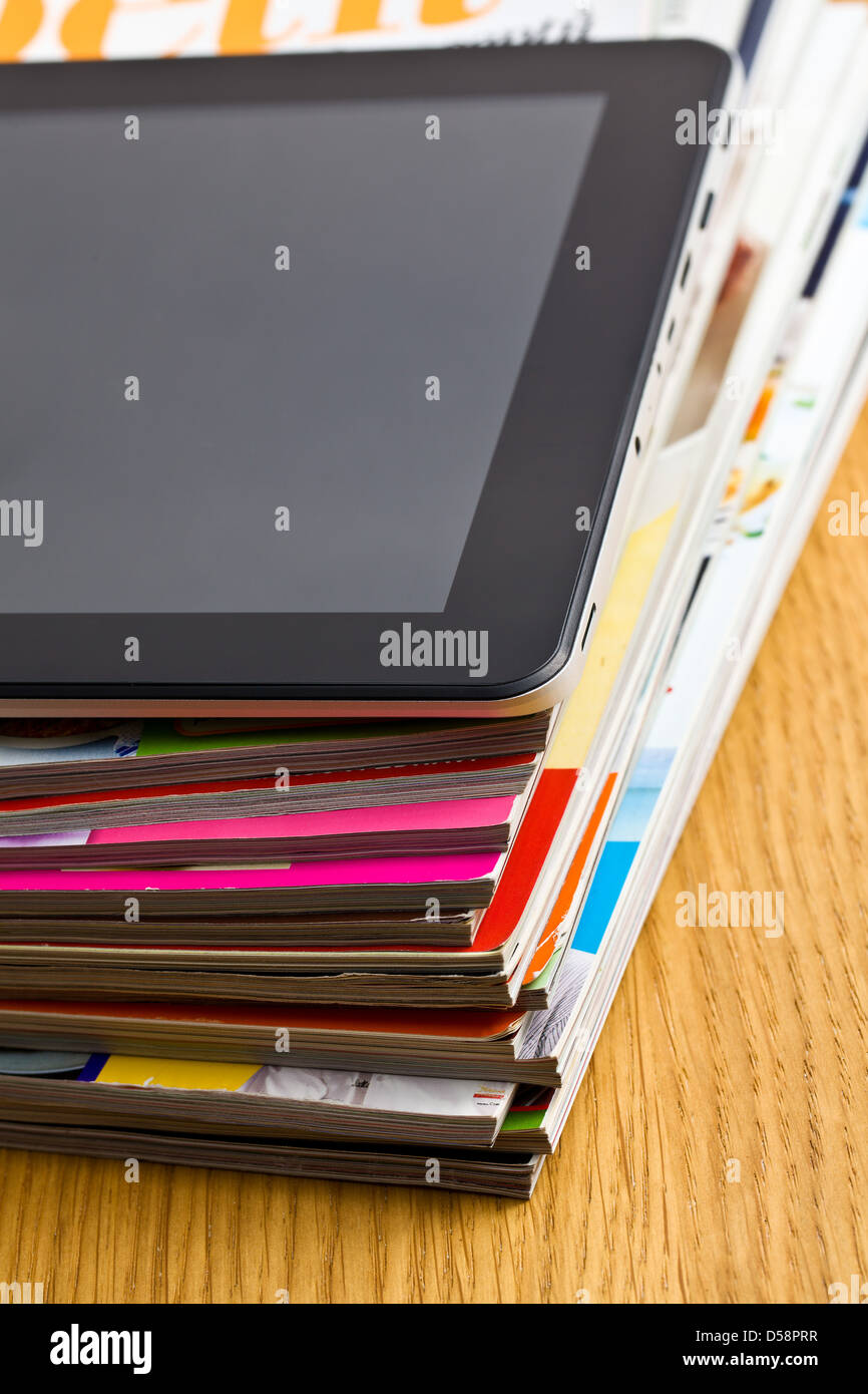 the touch tablet on magazines Stock Photo - Alamy