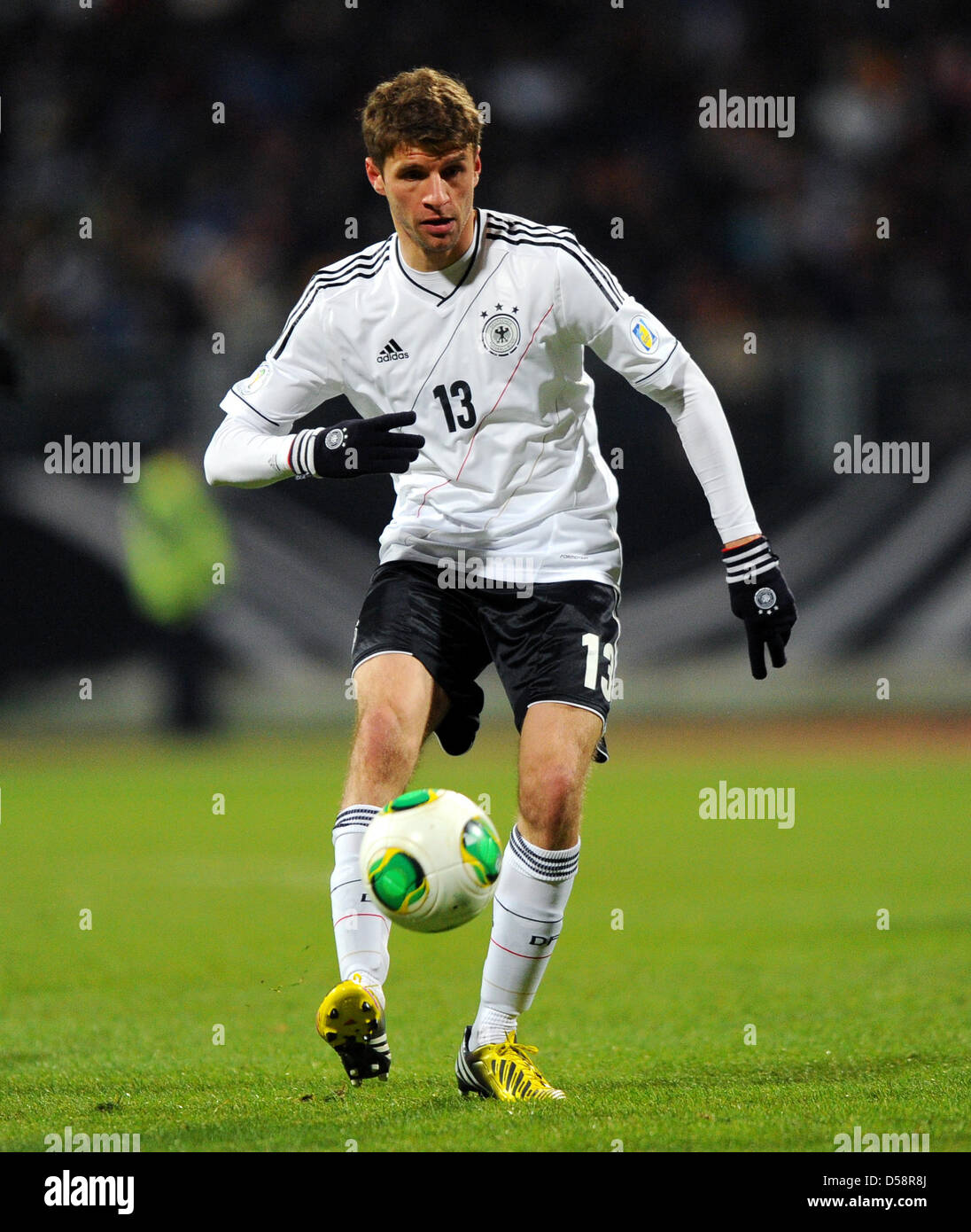 Nuremberg, Germany. 26th March 2013. Germany's Thomas Mueller kicks the ...
