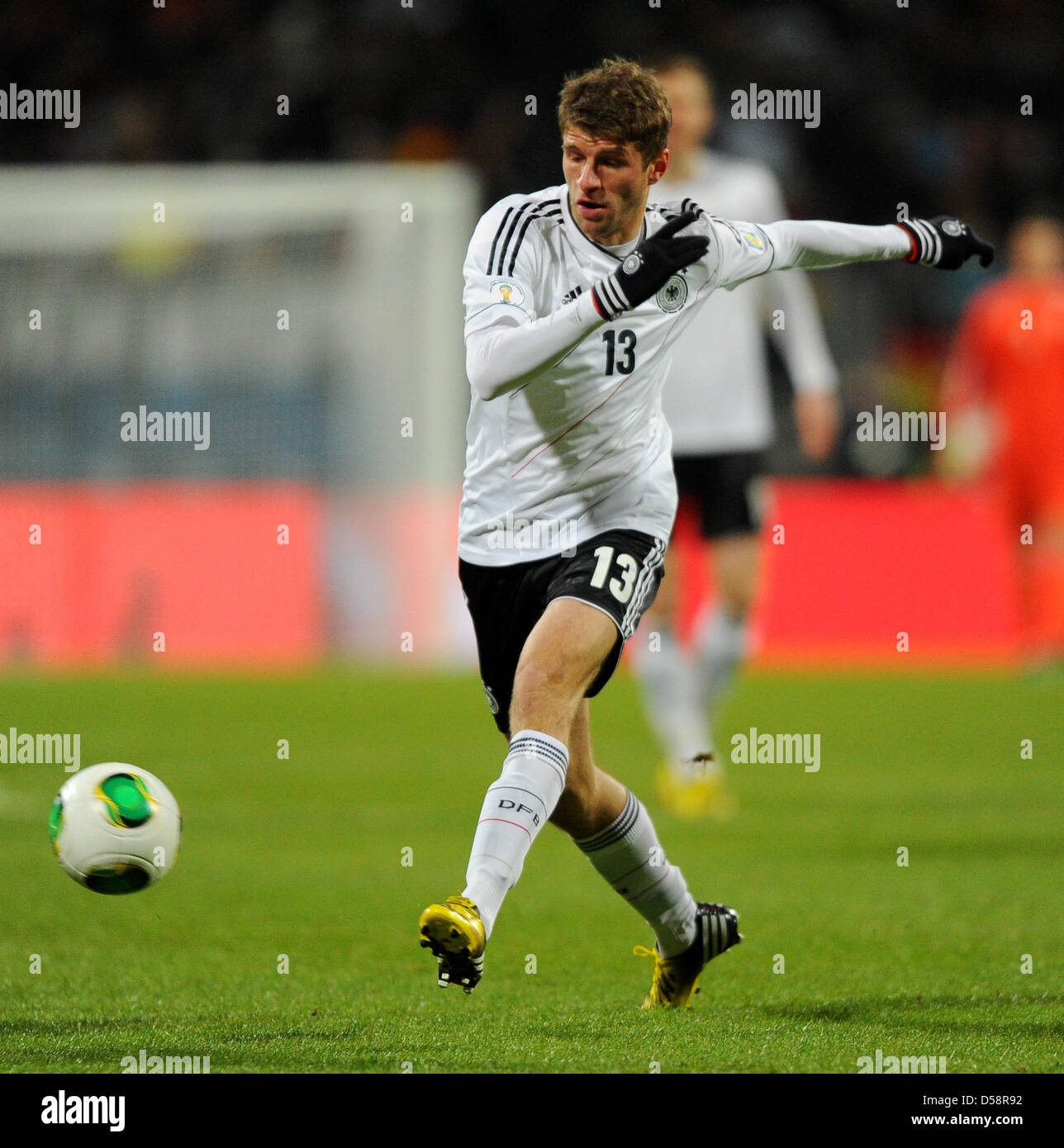 Nuremberg, Germany. 26th March 2013. Germany's Thomas Mueller kicks the ...