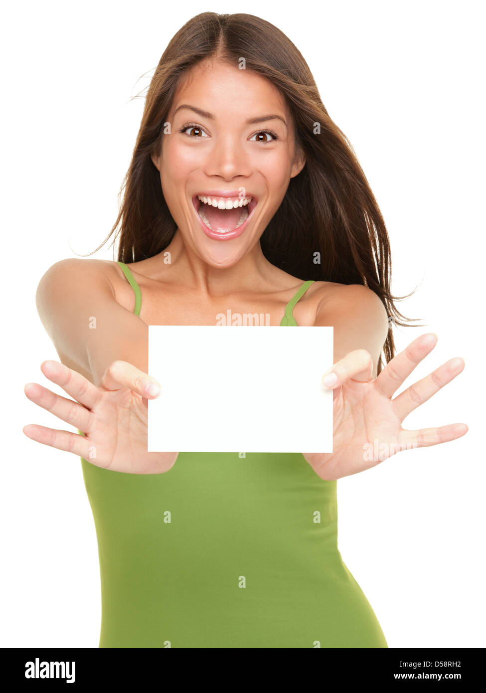 Portrait of excited young woman showing empty blank paper note card ...