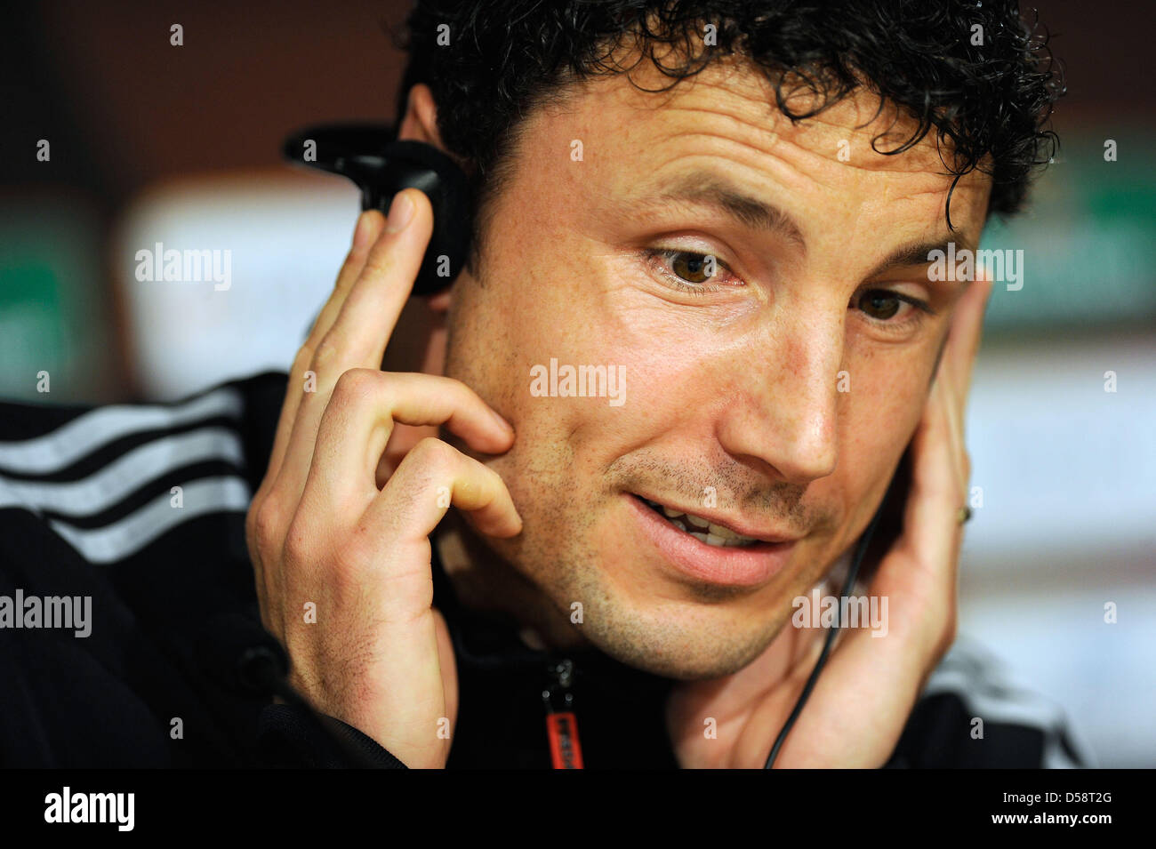 In the handout image provided by UEFA, Bayern captain Mark van Bommel ...