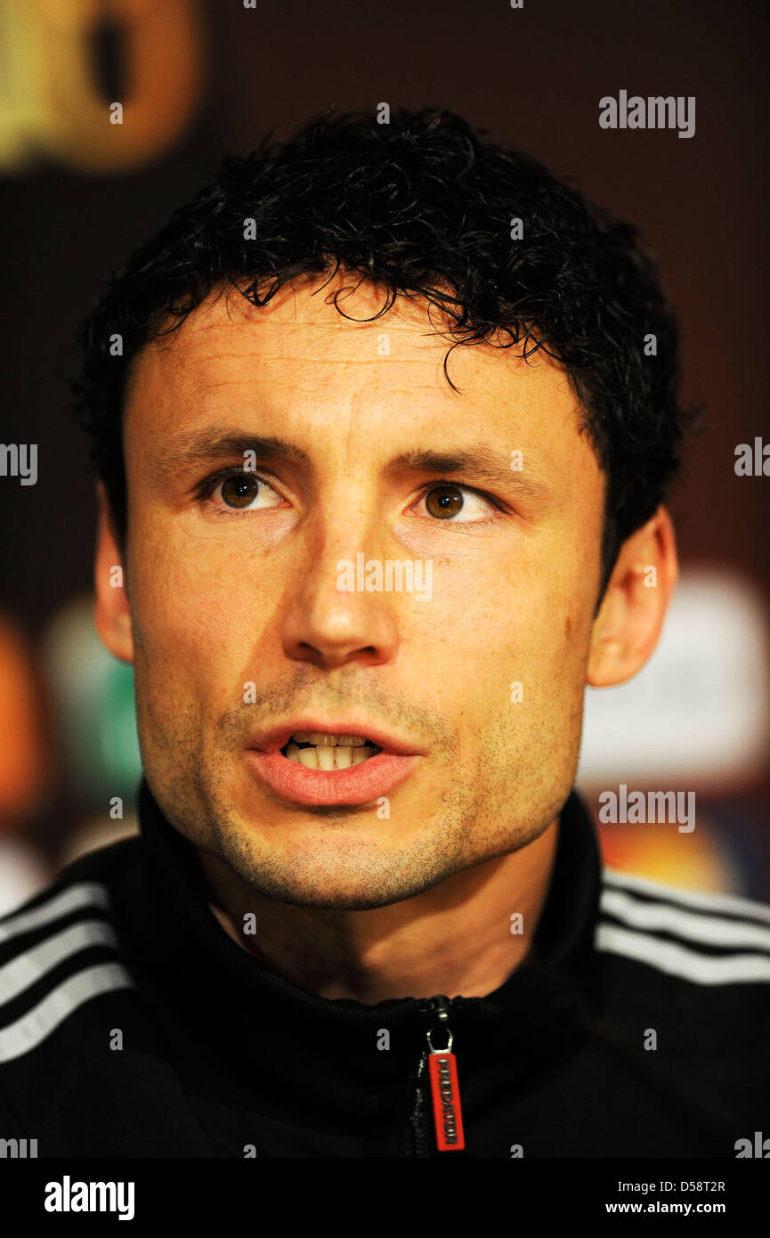 In the handout image provided by UEFA, Bayern captain Mark van Bommel ...
