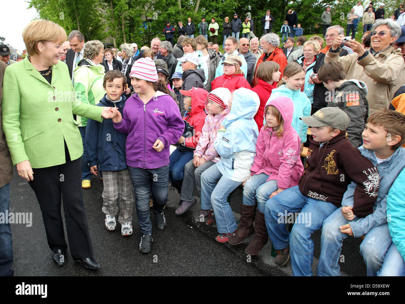German Chancellor Angela Merkel (L) visits the regional school with ...