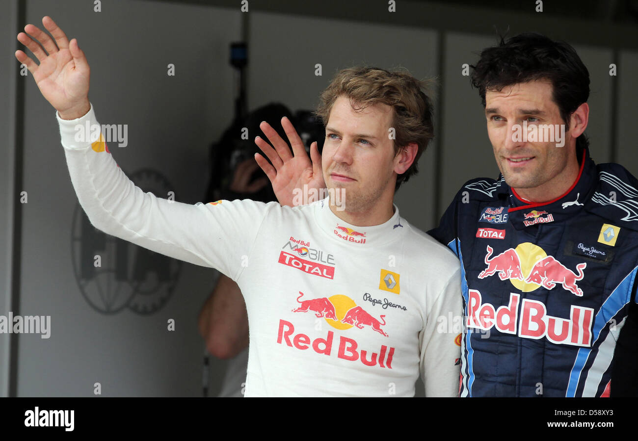 German Formula One driver Sebastian Vettel (L) and Australian driver ...