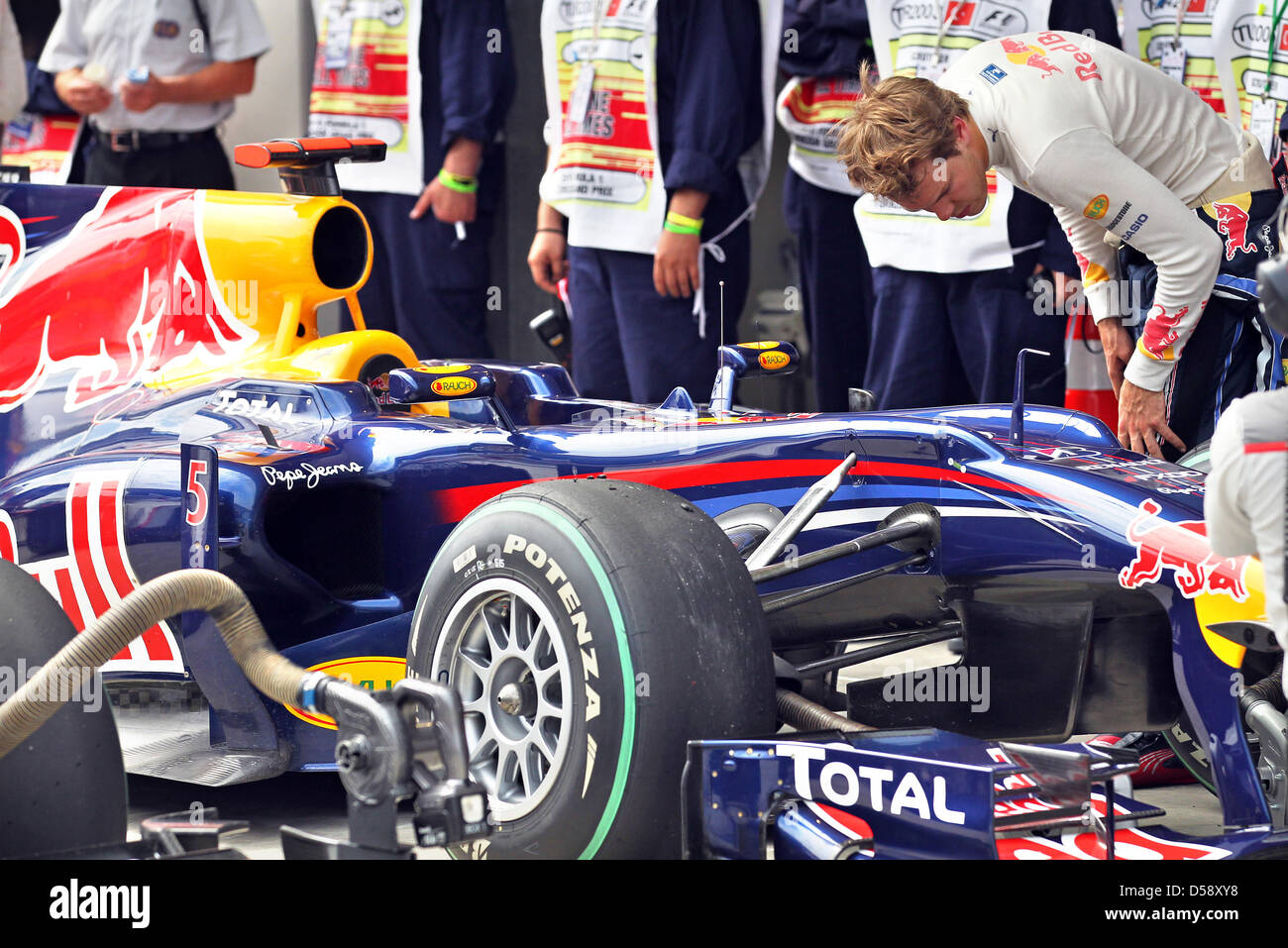 German Formula One driver Sebastian Vettel of Red Bull checks his race ...