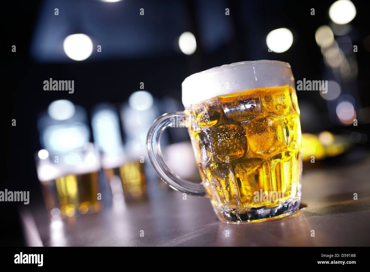 closeup of a beer mug in a bar Stock Photo - Alamy