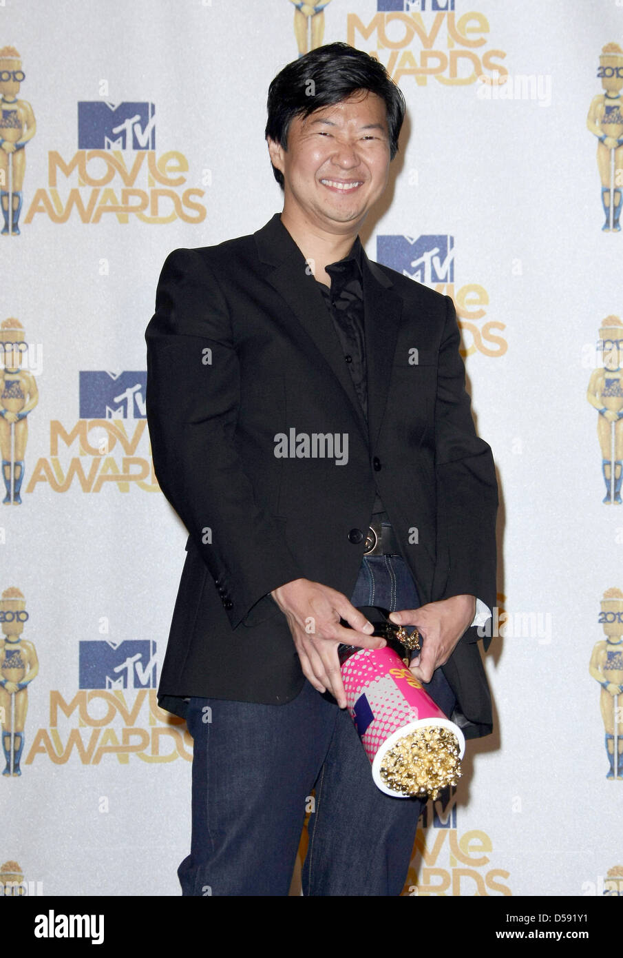 US actor Ken Jeong poses with his MTV Movie Award for Best WTF Moment ...