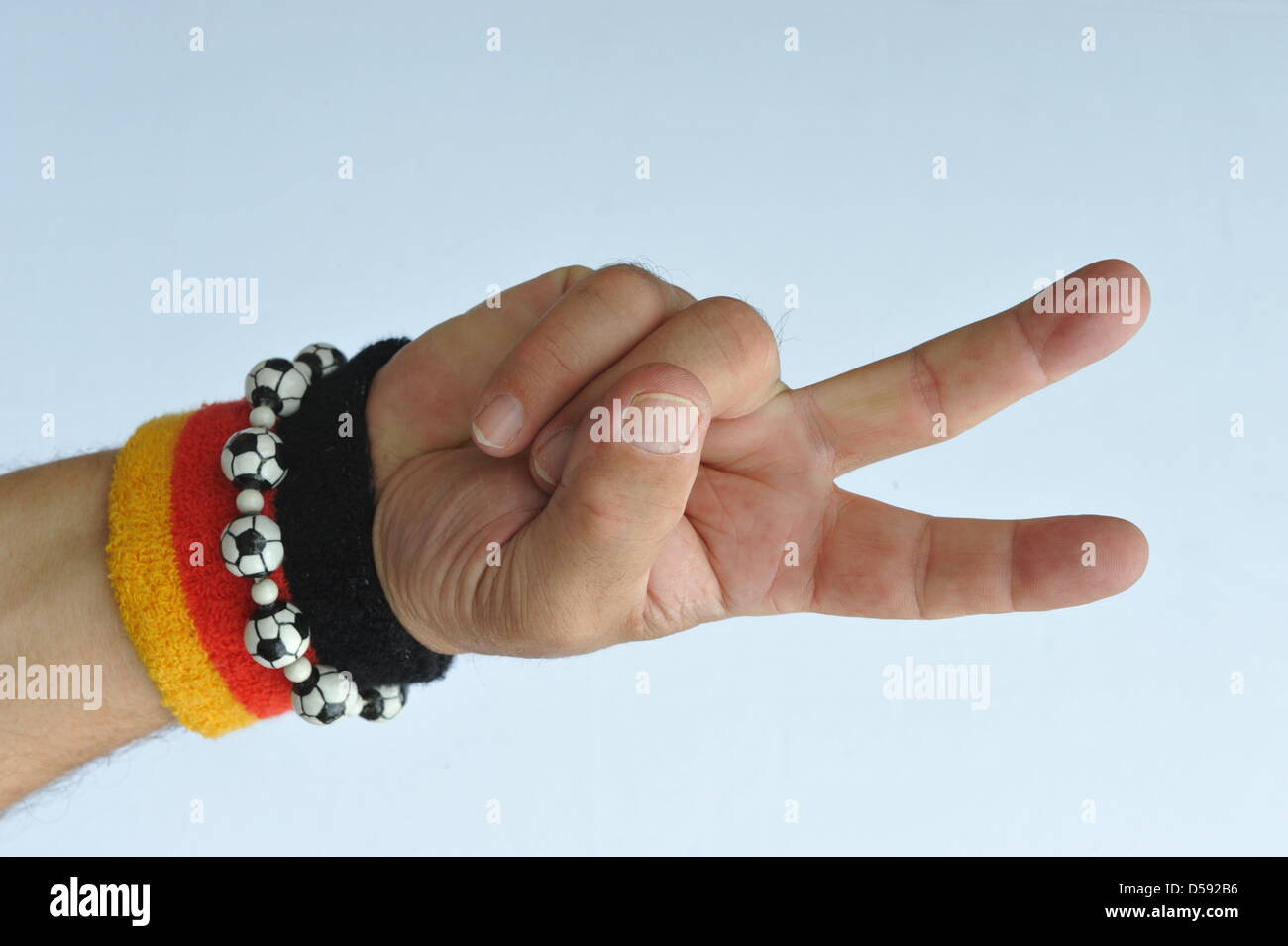A man's hand signals a victory sign in Munich, Germany, 07 June 2010 ...