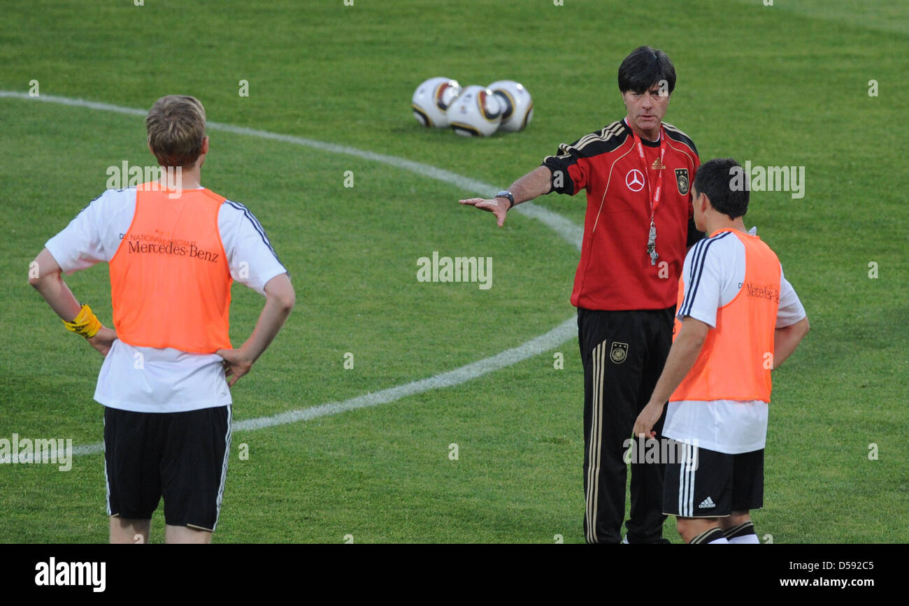 German national coach Joachim Loew (C) gestures during a training ...