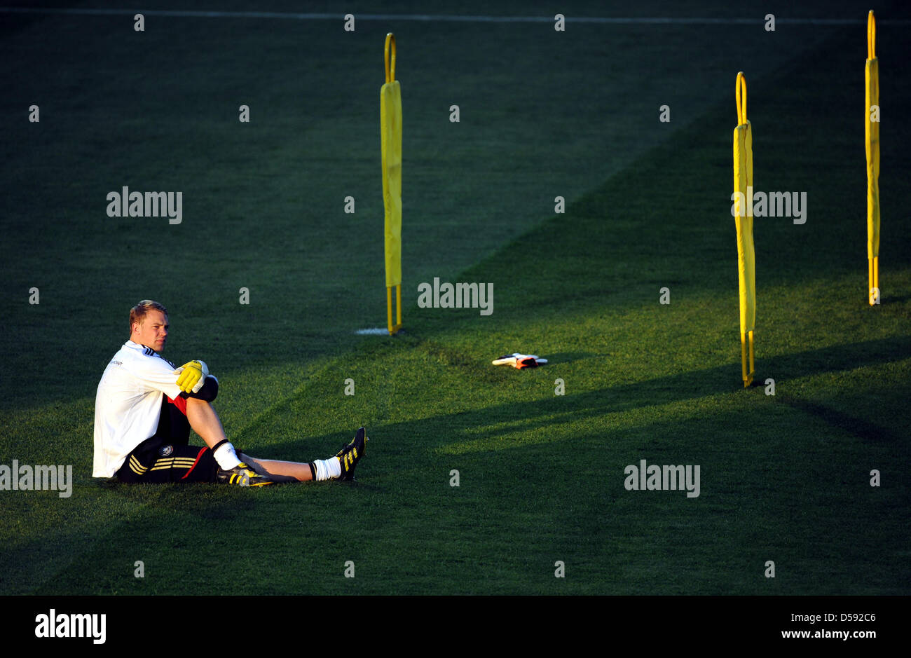 German national goalkeeper Manuel Neuer sits on the ground during a ...
