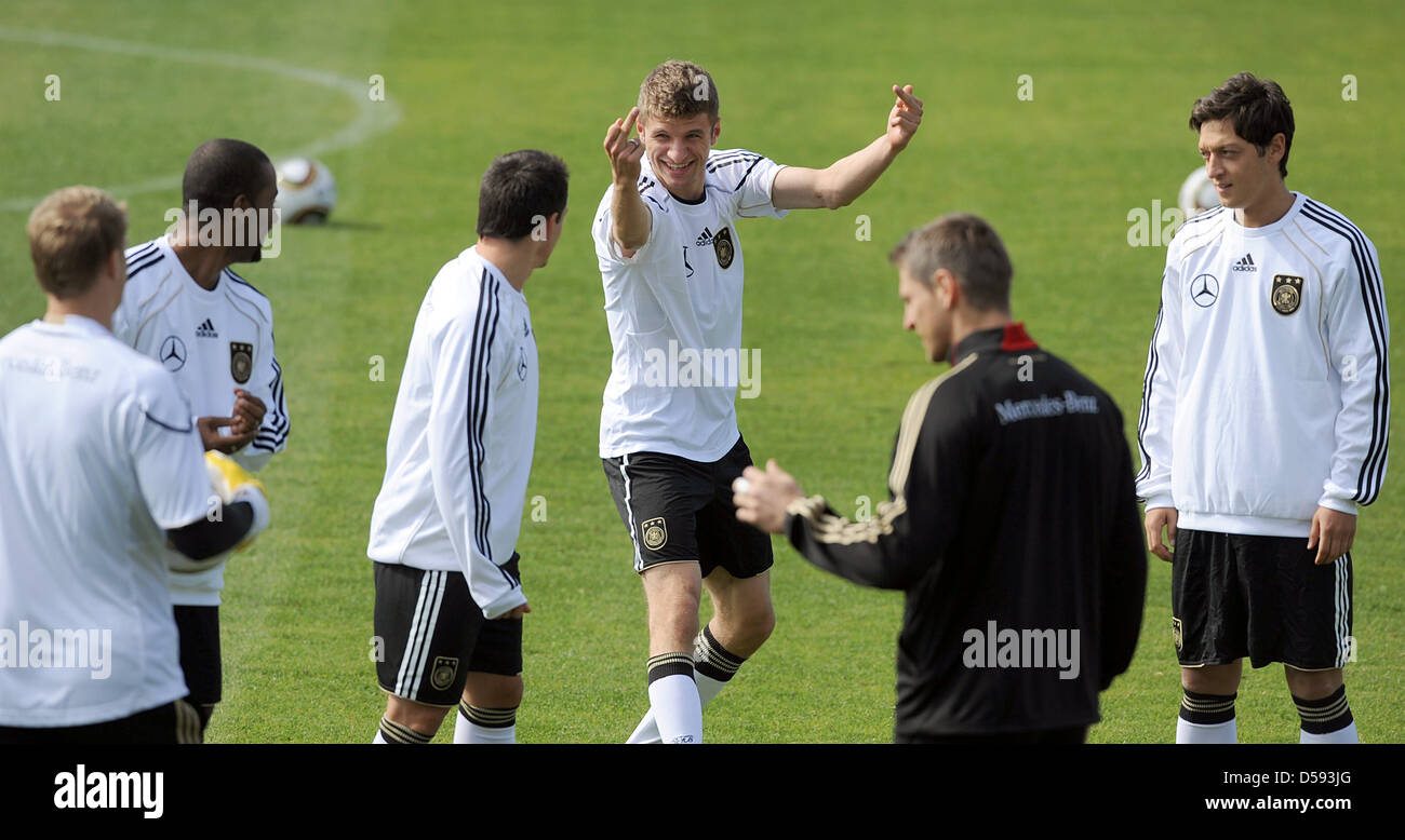 German international Thomas Mueller (C) flips the bird to teammates ...