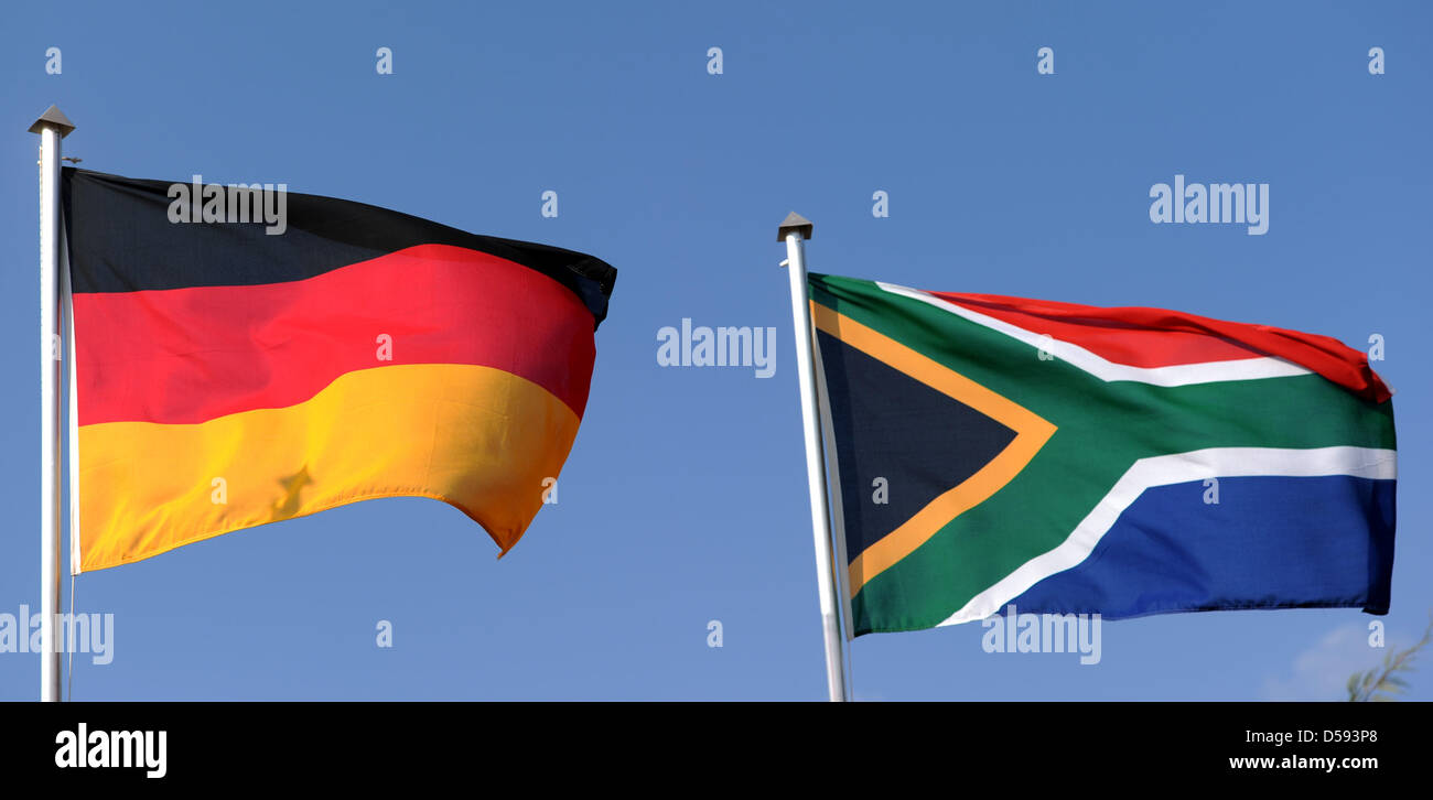 A German and a South Africa flag wave at the entrance to the German ...