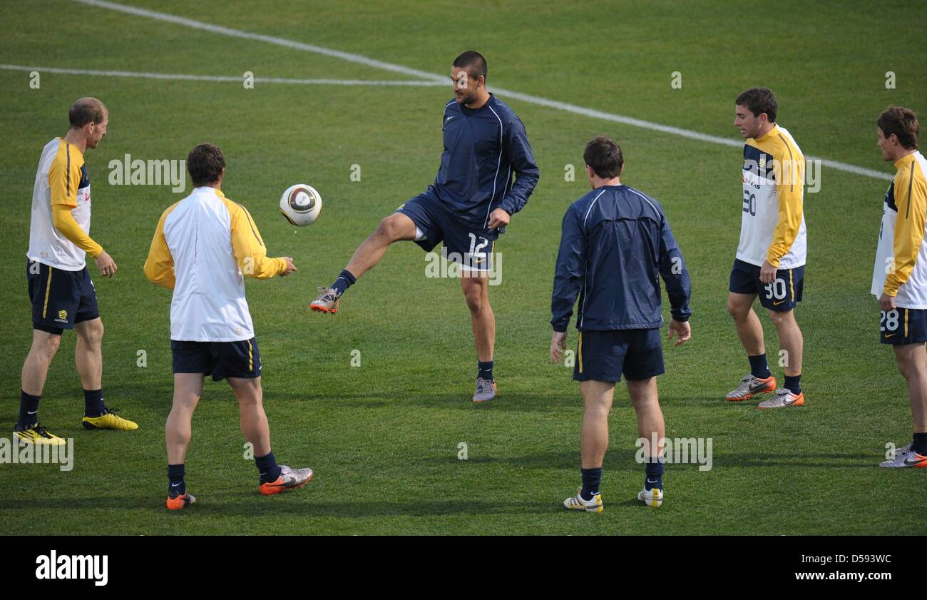 Australian goalkeeper Adam Federici (C) and his team members during a ...