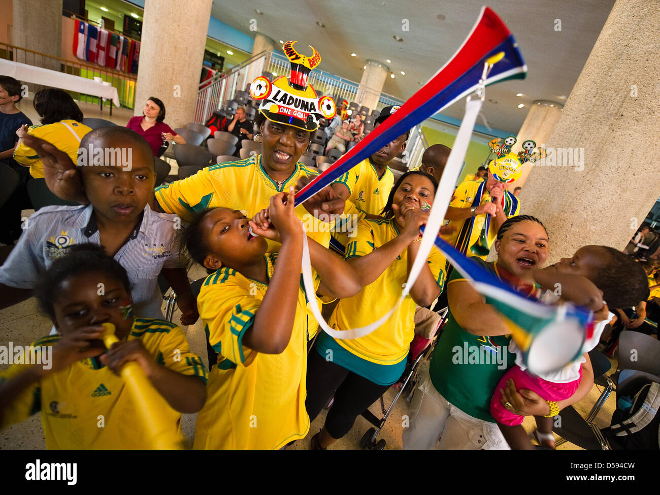 South African soccer fans follow the openeing ceremony of the FIFA ...