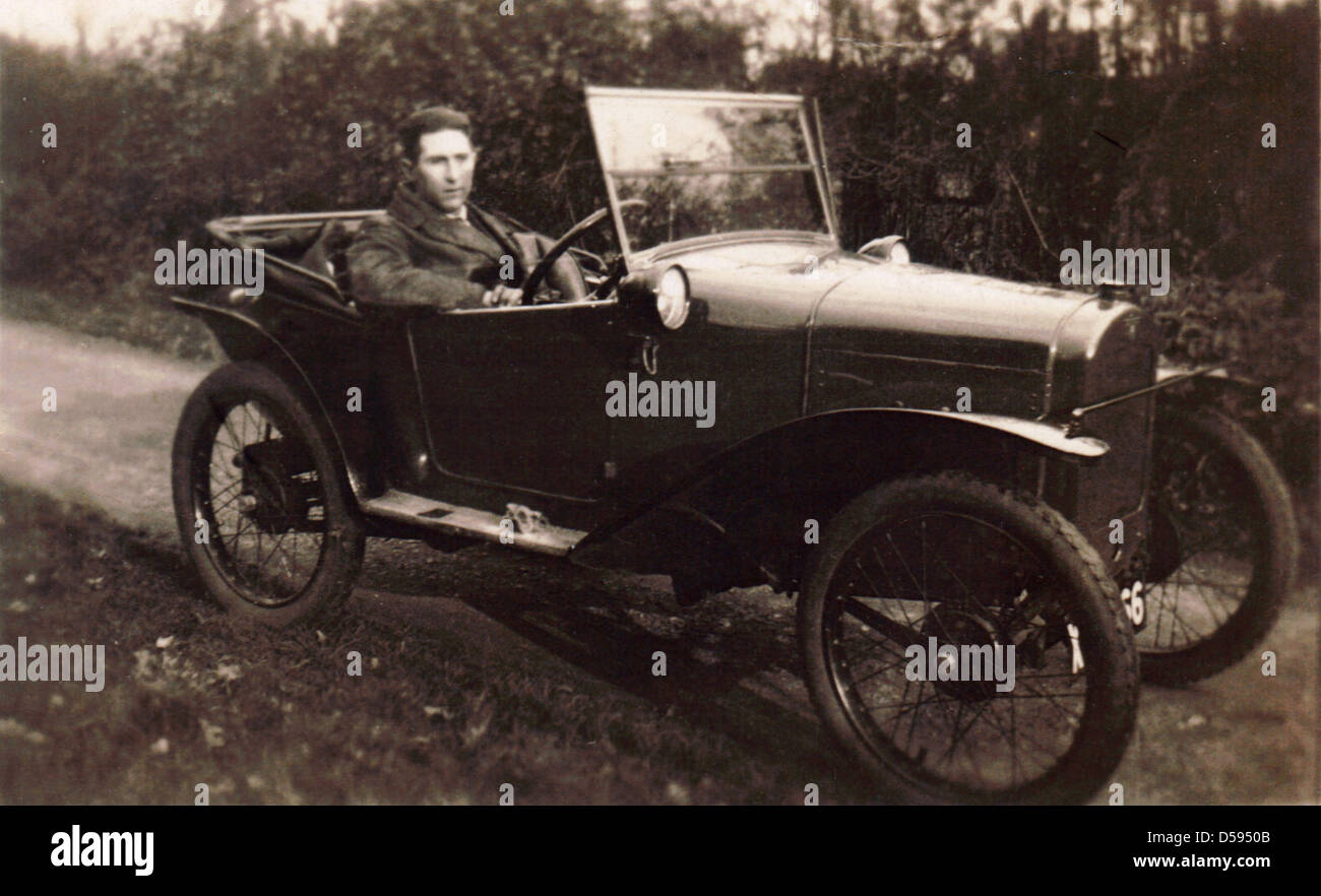 A man sitting in an Austin car in the 1920s, England, UK Stock Photo ...