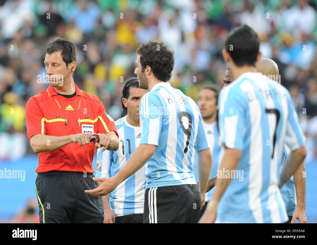 German referee Wolfgang Stark argues with Argentina's Gonzalo Higuain ...