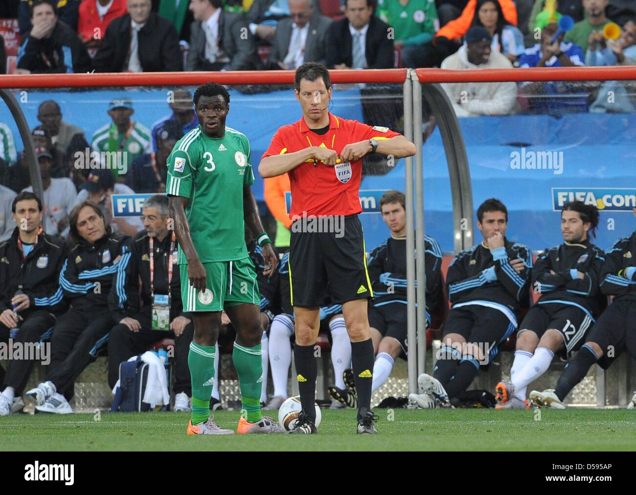 German referee Wolfgang Stark (R) stands next to Nigeria's Taye Taiwo ...