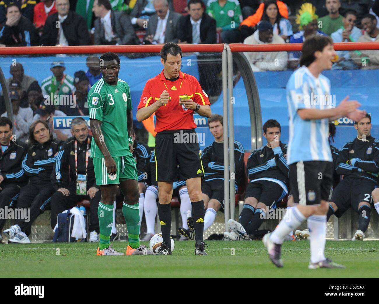 German referee Wolfgang Stark (R) stands next to Nigeria's Taye Taiwo ...