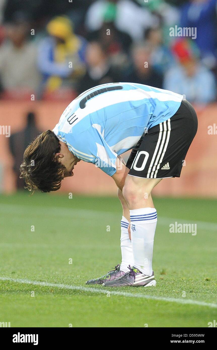 Argentina's Lionel Messi (C) hangs down during the 2010 FIFA World Cup ...