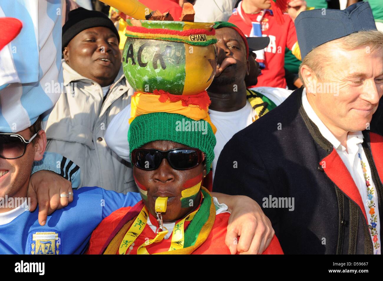 Ghanaian fans celebrate in front of the stadium prior to the 2010 FIFA ...