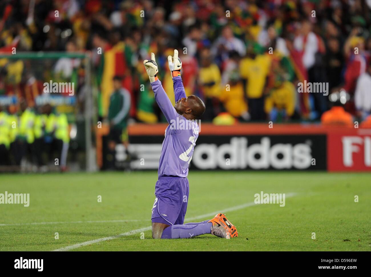 Ghana's goalkeeper Richard Kingson kneels on the pitch during the 2010 ...