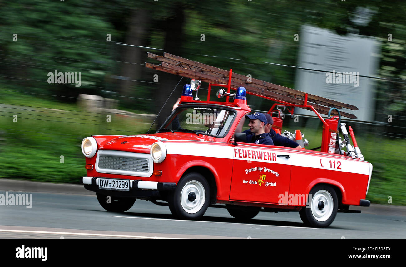 A trabant as a fire fighter vehicle drives in a parade through Leipzig ...