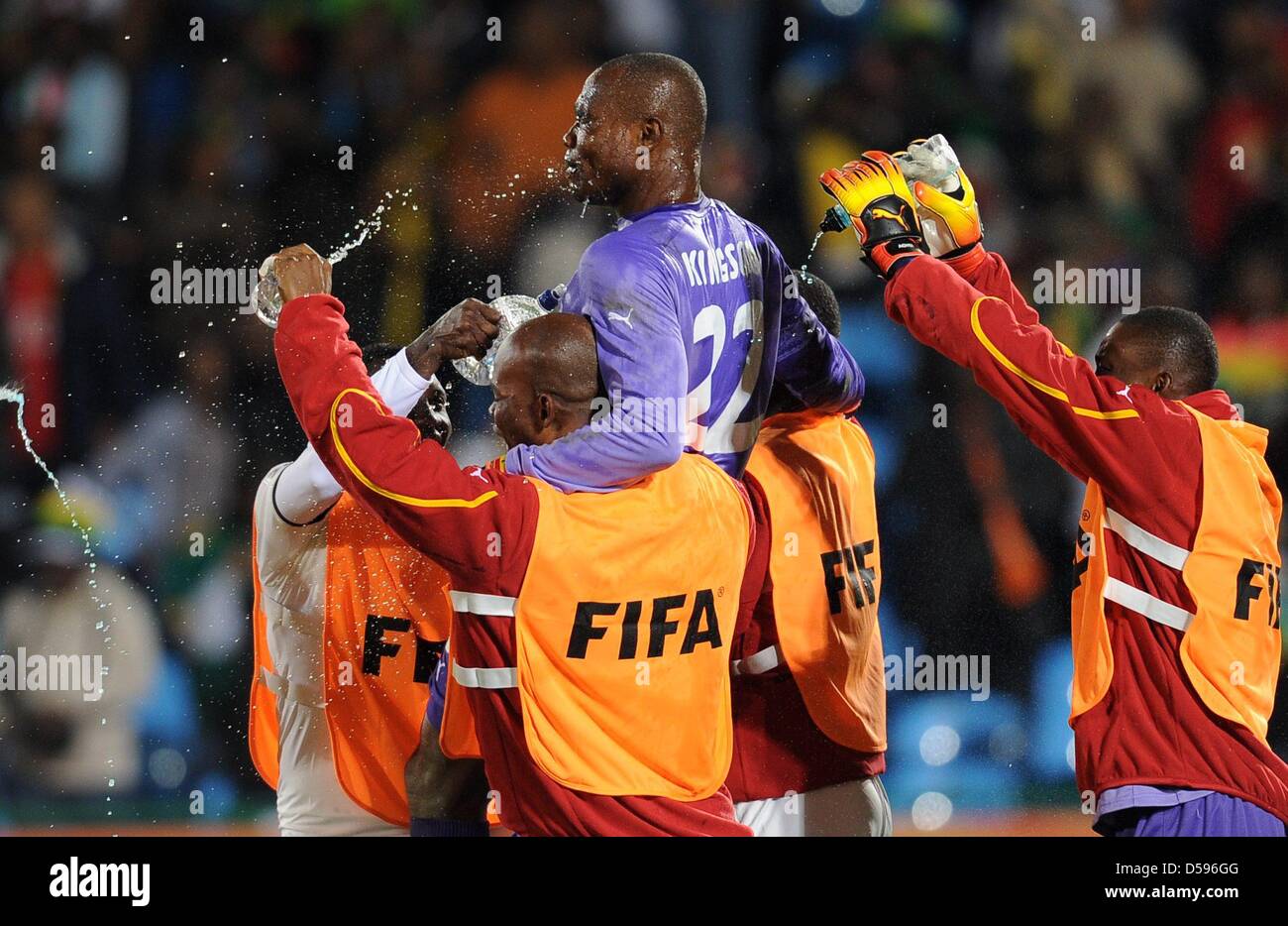 Ghana's goalkeeper Richard Kingson is celebrated by the team after the ...