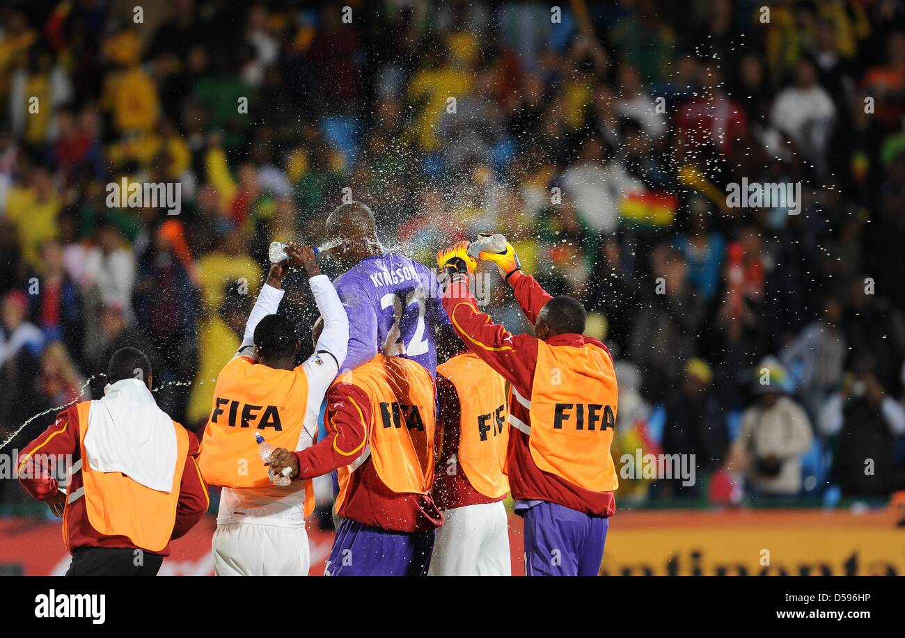 Ghana's goalkeeper Richard Kingson is celebrated by the team after the ...