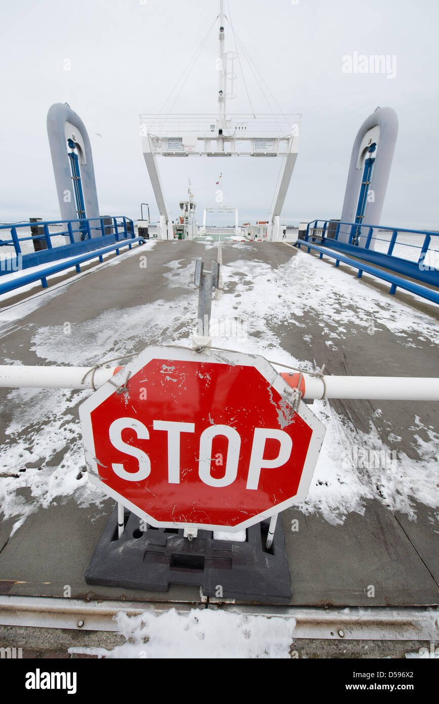 A stop sign is visible at the ferry dock of the car ferry of the ...