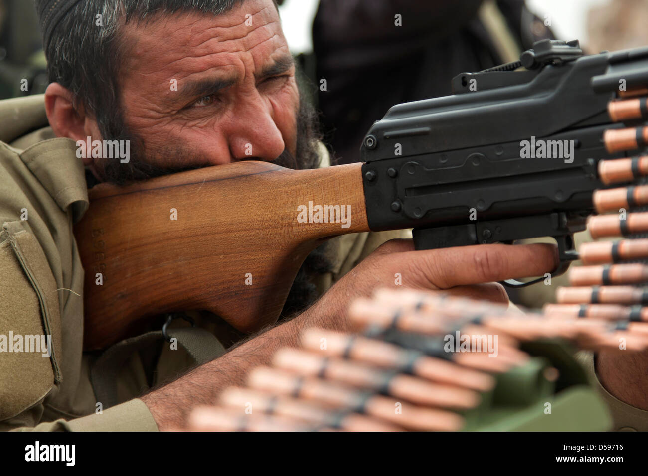 Afghan Local Policeman fires a machine gun during weapons training ...