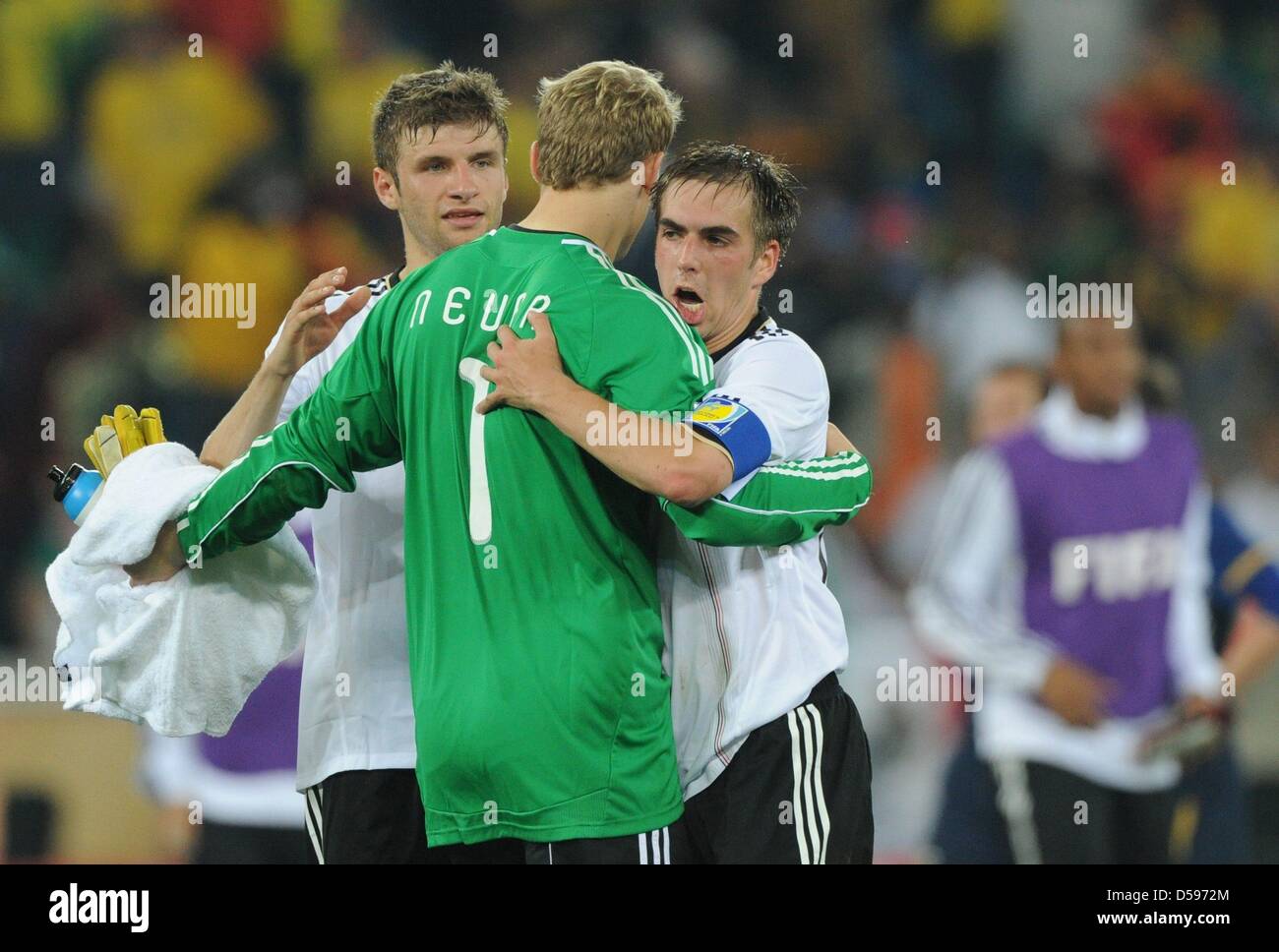 Germany's goalkeeper Manuel Neuer celebrates with Philipp Lahm (R) and ...