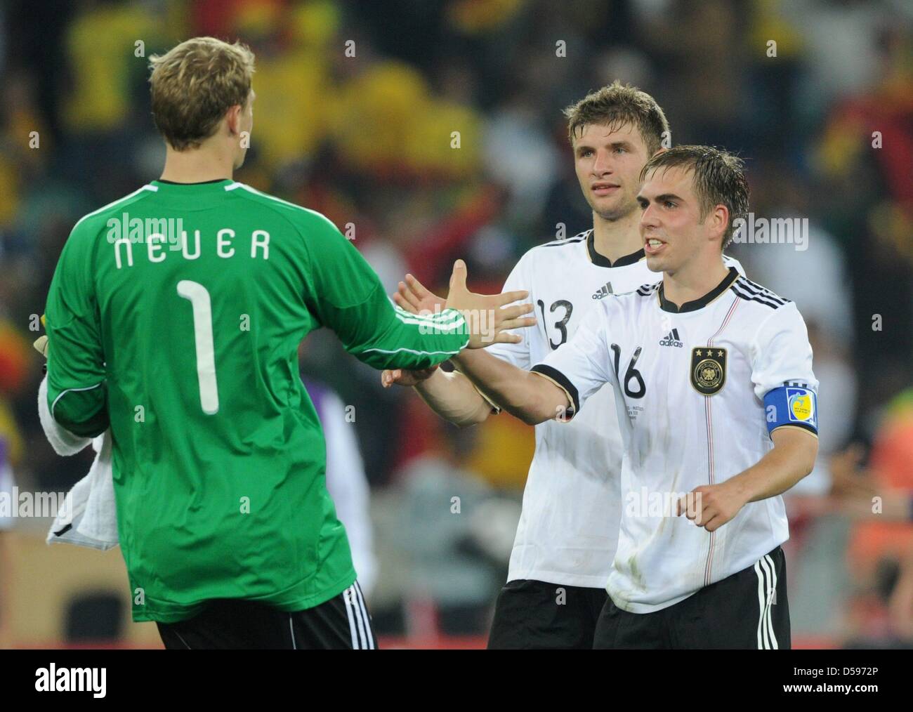 Germany's goalkeeper Manuel Neuer celebrates with Philipp Lahm (R) and ...