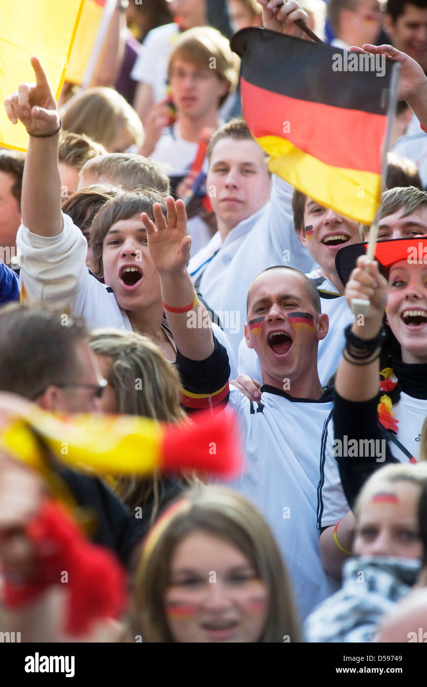 Fans cheer the German team as they attend a public broadcast of the ...