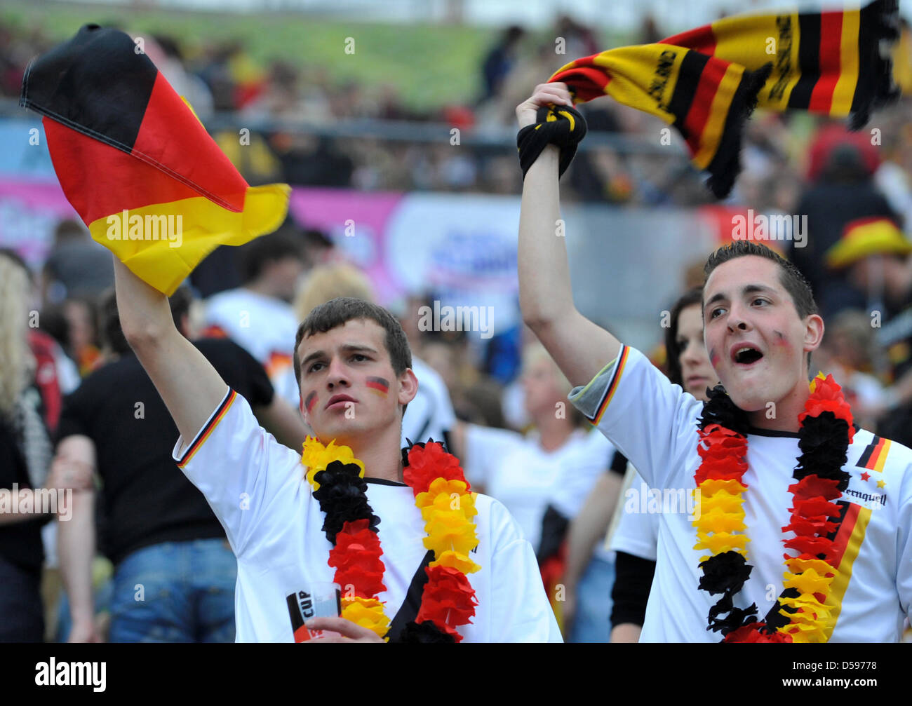 Fans cheer the German team as they attend a public broadcast of the ...