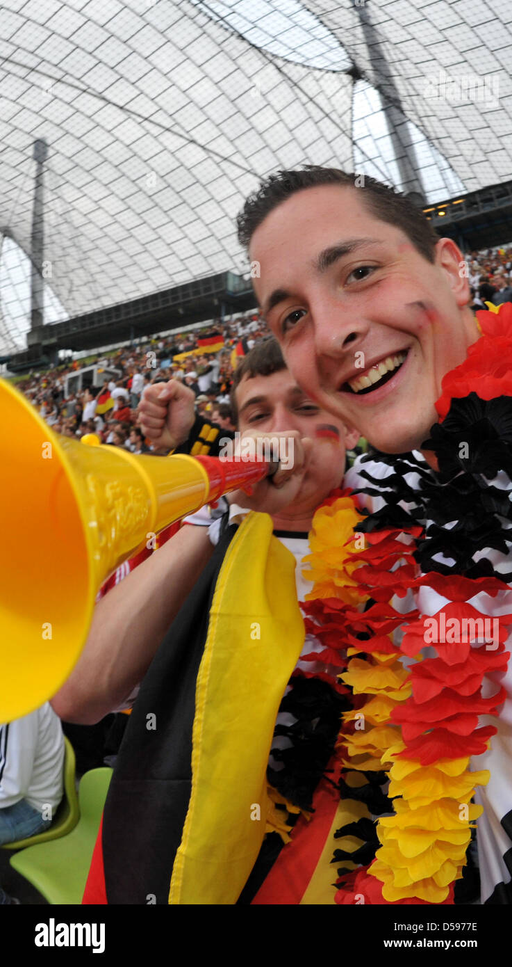 Fans cheer the German team as they attend a public broadcast of the ...