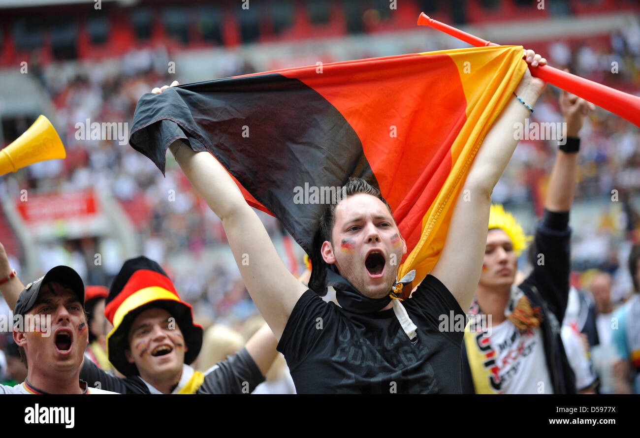 Fans cheer the German team as they attend a public broadcast of the ...