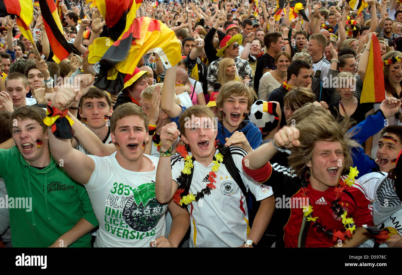 Fans cheer the German team as they attend a public broadcast of the ...