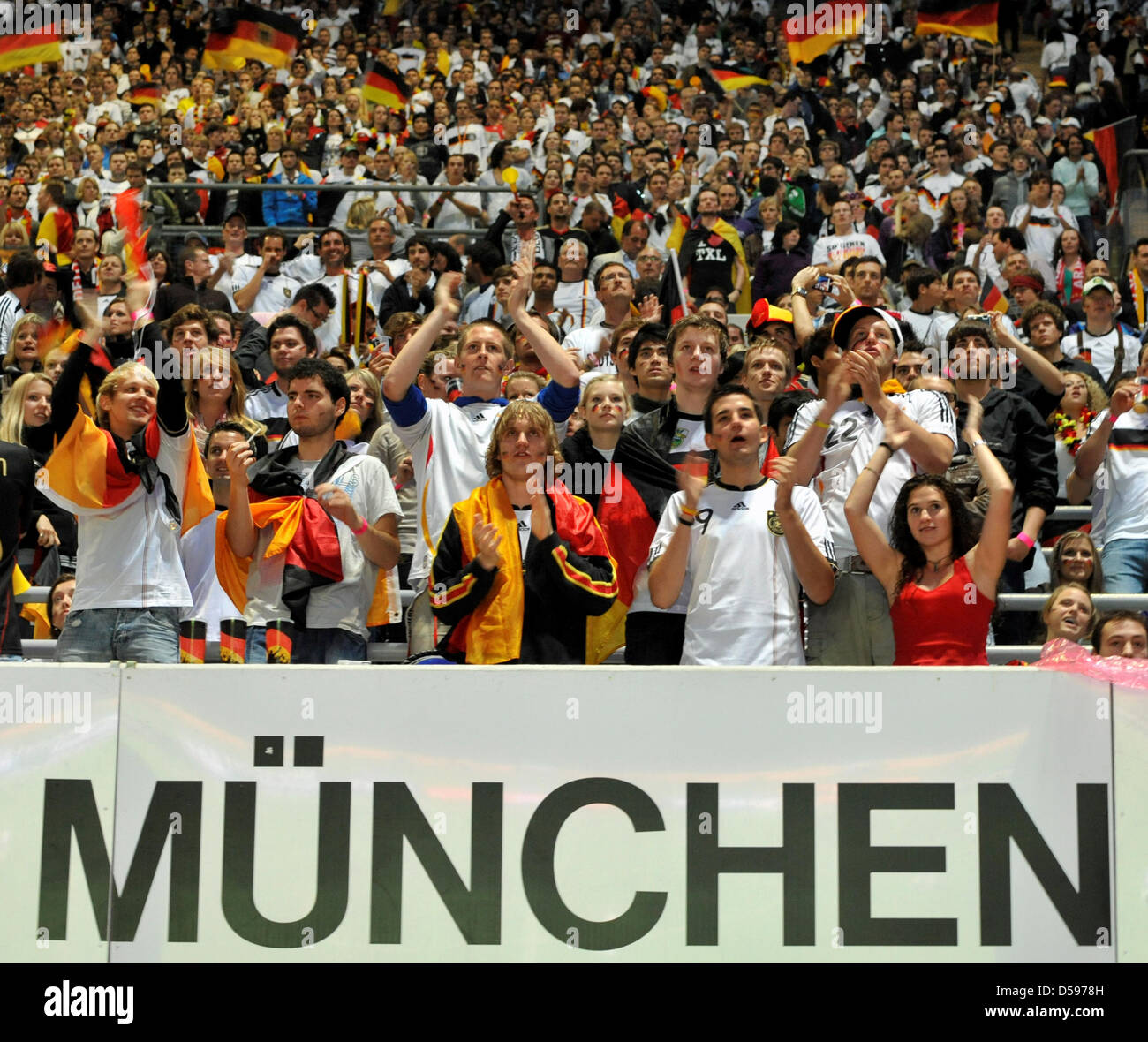 Fans cheer the German team as they attend a public broadcast of the ...