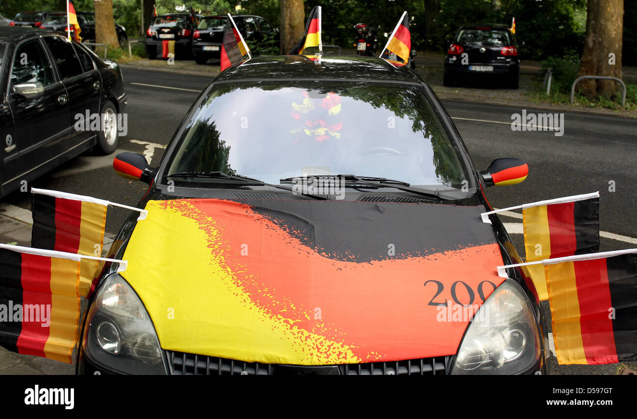 A car is decorated with fan merchandise in Nuremberg, Germany, 13 June ...