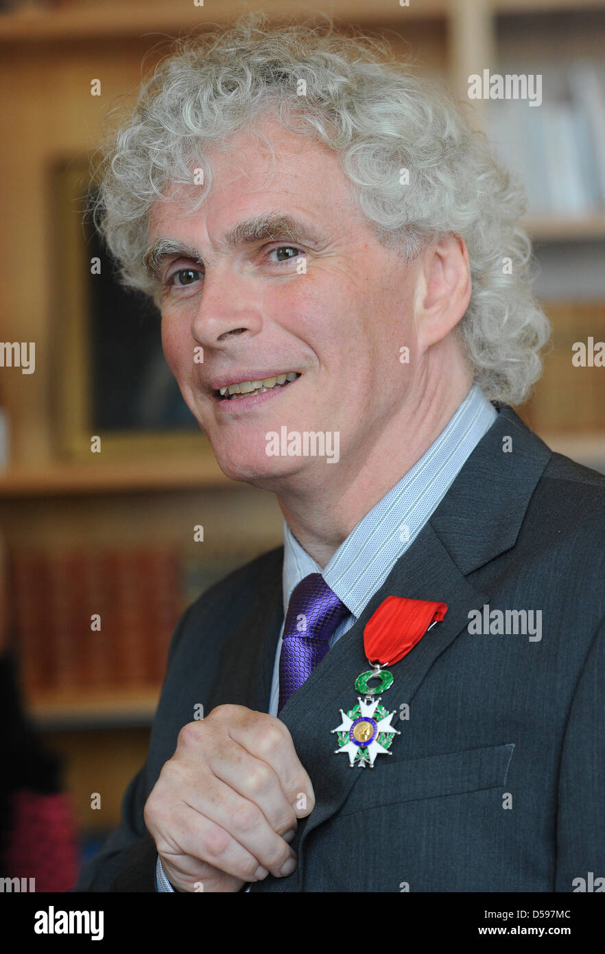 Sir Simon Rattle, principal conductor of Berlin Philharmonics, smiles ...