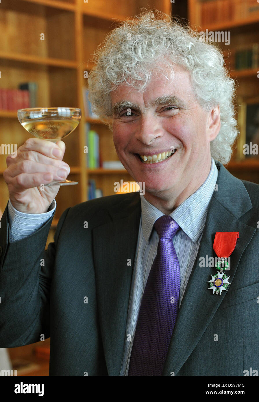 Sir Simon Rattle, principal conductor of Berlin Philharmonics, cheers ...