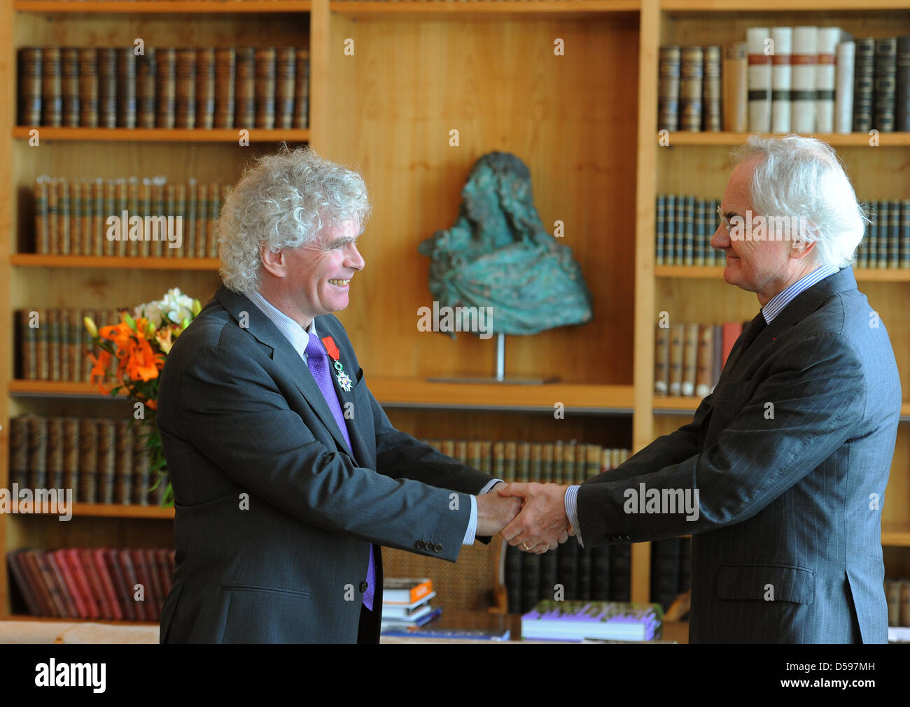 Sir Simon Rattle (L), principal conductor of Berlin Philharmonics, is ...