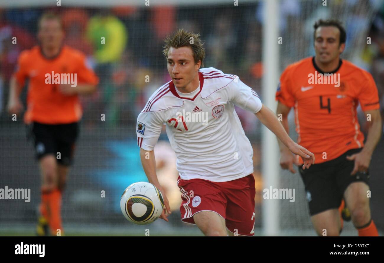Christian Eriksen (C) of Denmark vies with Joris Mathijsen of the ...
