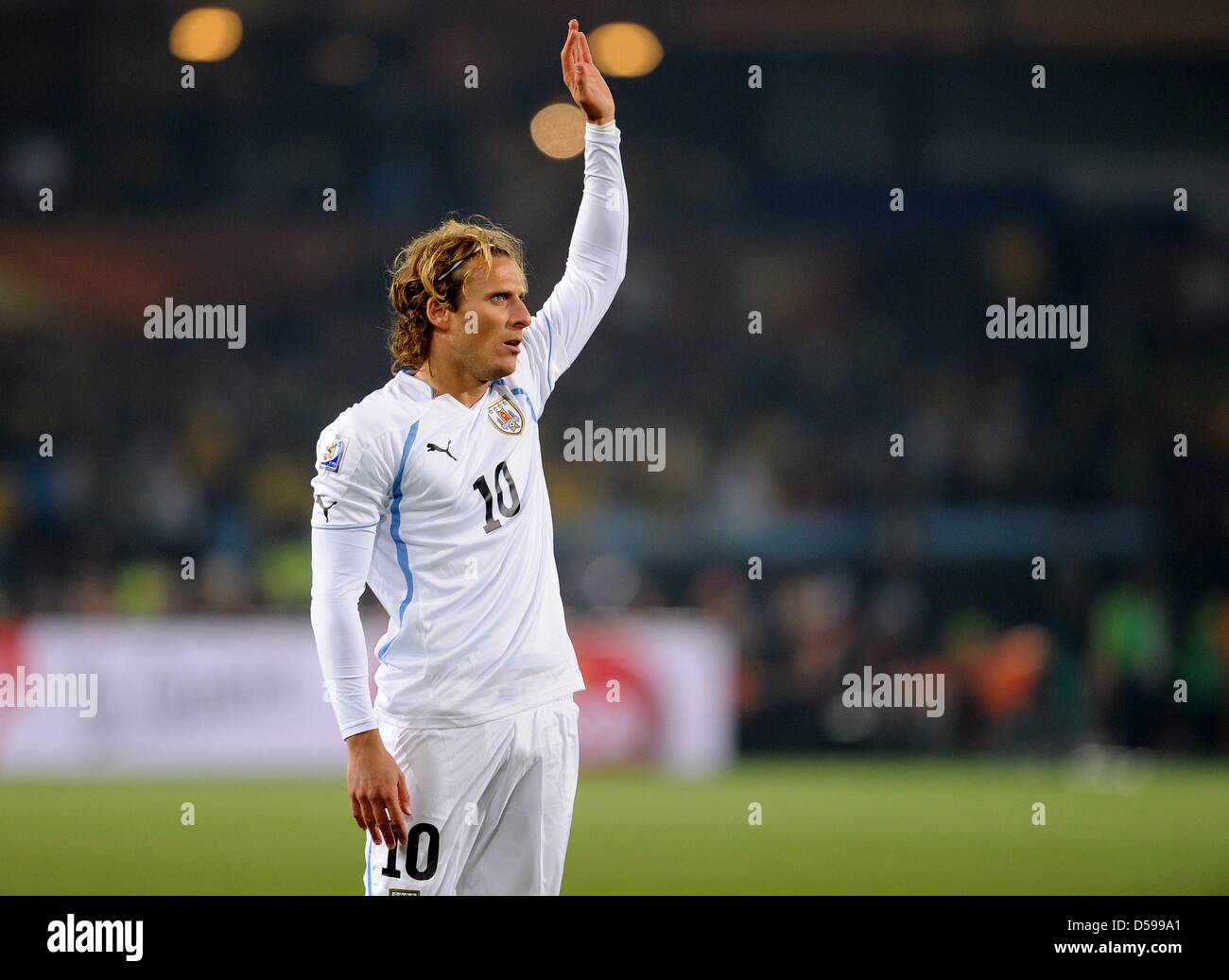 Uruguay's Diego Forlan celebrates scoring the 1-0 during the 2010 FIFA ...