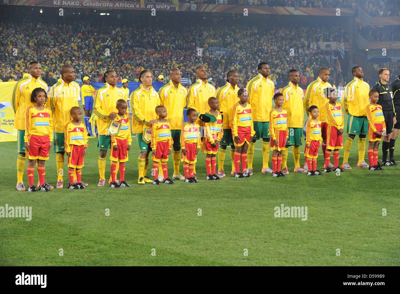 South Africa's players listen to the national anthem during the 2010 ...