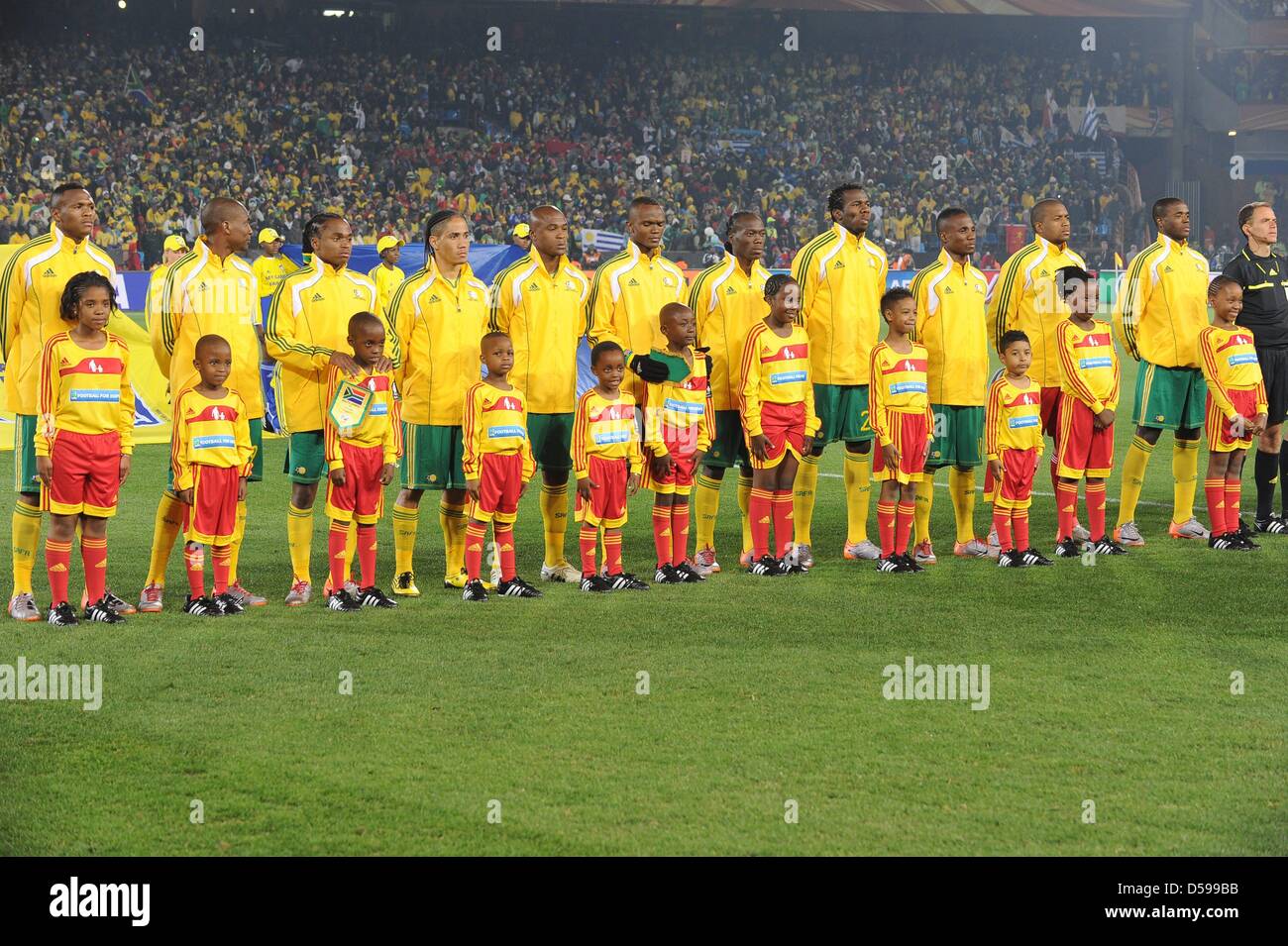 South Africa's players listen to the national anthem during the 2010 ...