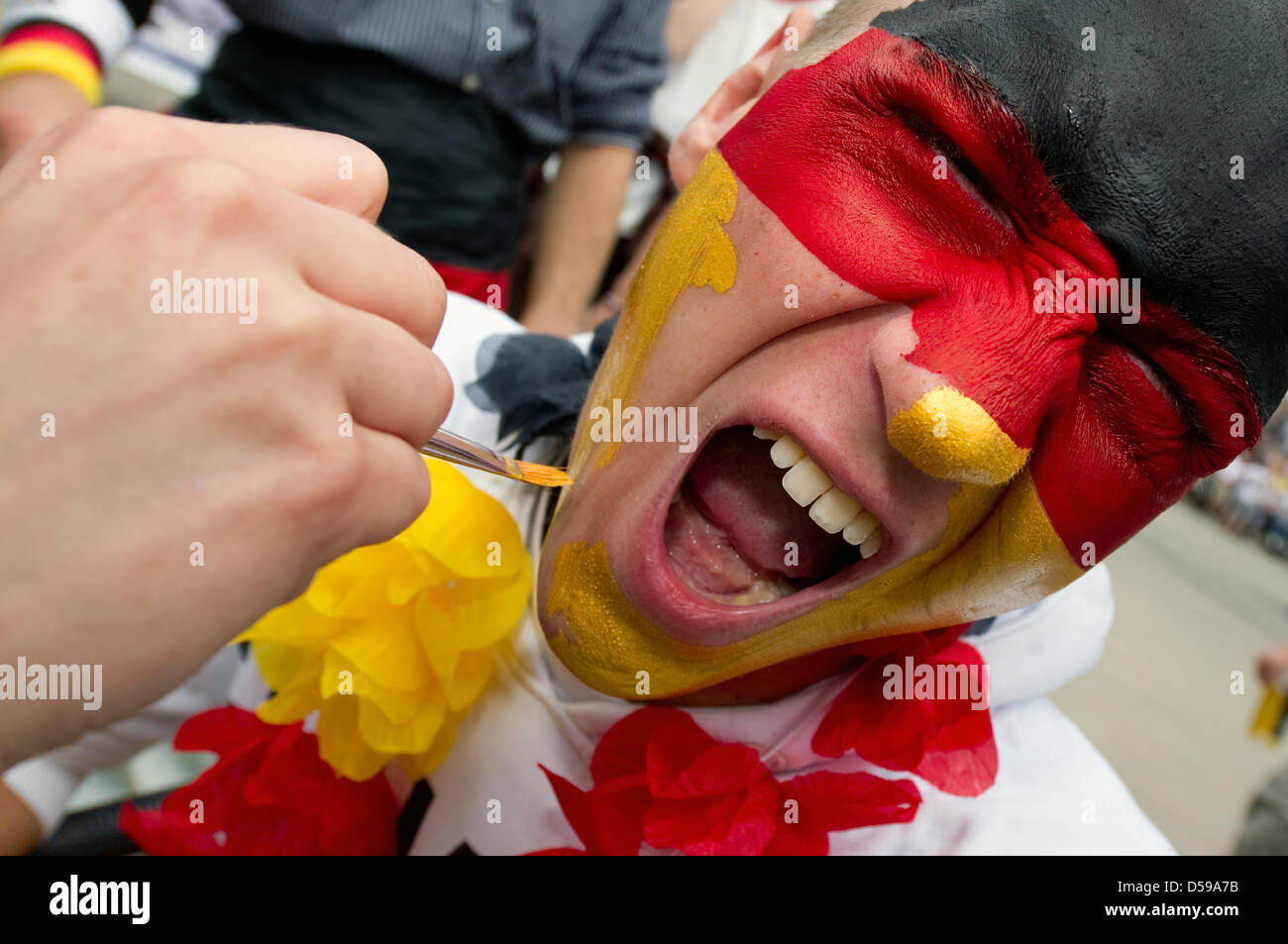 A Germany support celebrates during a public broadcast in Dresden ...