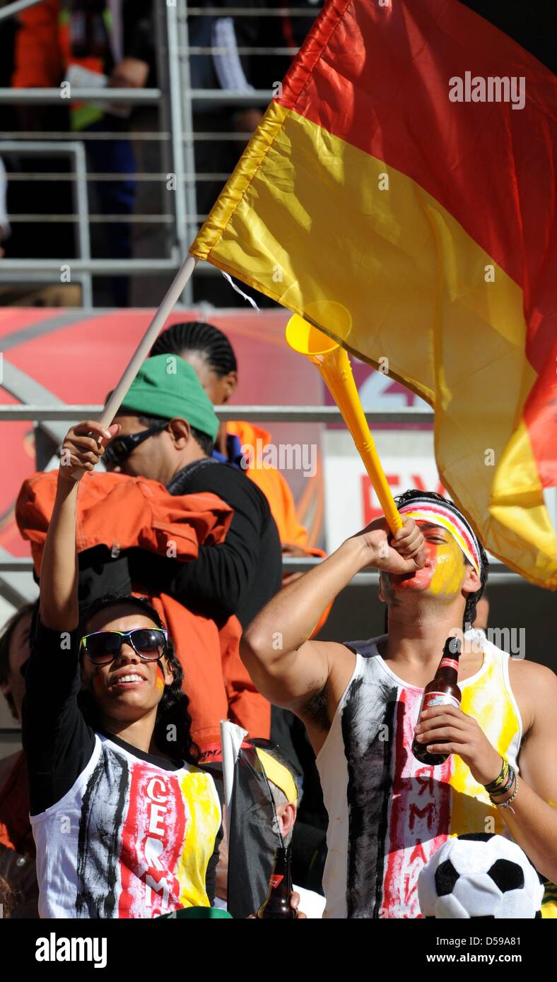 German fans celebrate on the stand prior to the 2010 FIFA World Cup ...