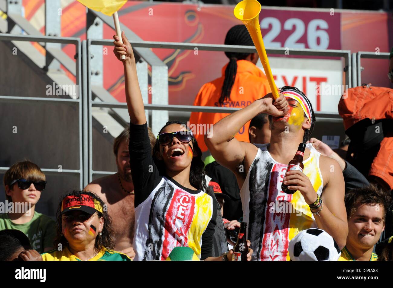 German fans celebrate on the stand prior to the 2010 FIFA World Cup ...