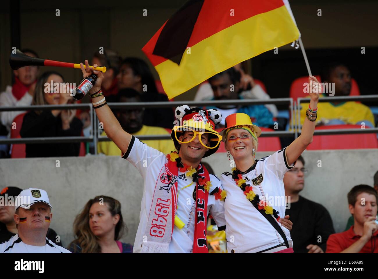 German fans celebrate on the stand prior to the 2010 FIFA World Cup ...